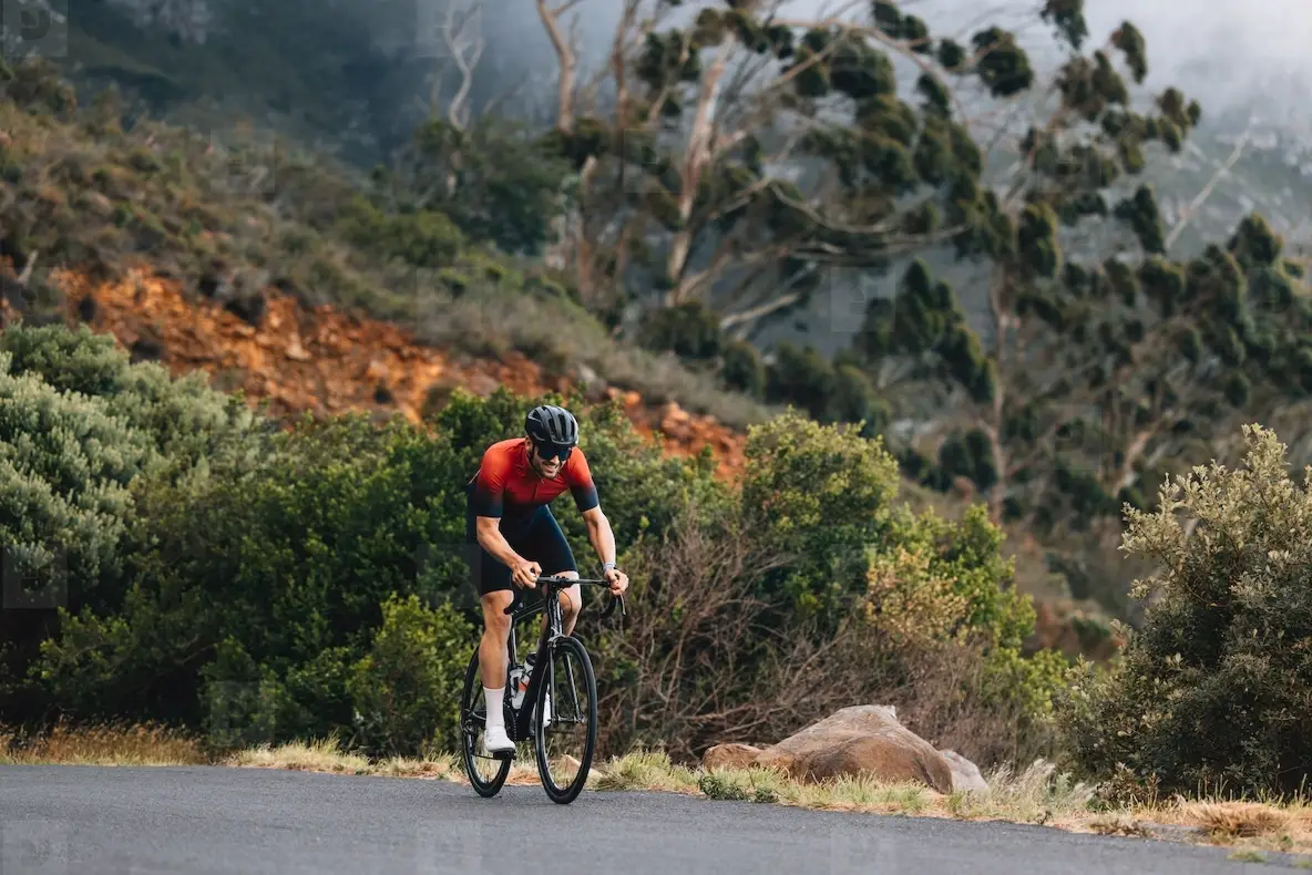 Young Male Cyclist Practicing In Wild Terrain. Professional Triathlete ...