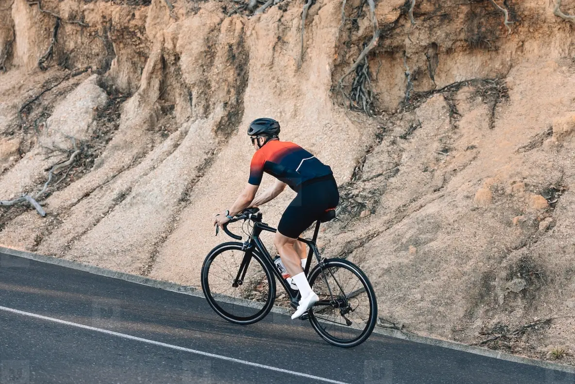 Male Cyclist Practicing On His Road Bike At A Hill Photo (271588 ...