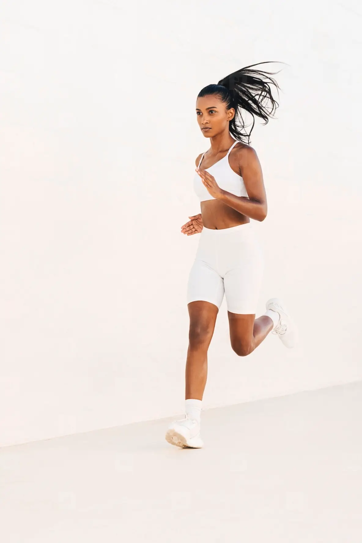 Fit Female In White Fitness Attire Jogging Outdoors. Full Length Of A ...