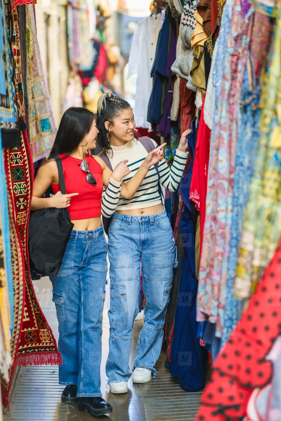 Two Asian Girls Tourists Shopping Clothes In Street Bazaar Photo ...