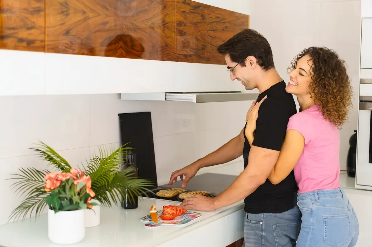 Happy Adult Man Standing Near Cooking Range And Smiling Woman Embracing ...