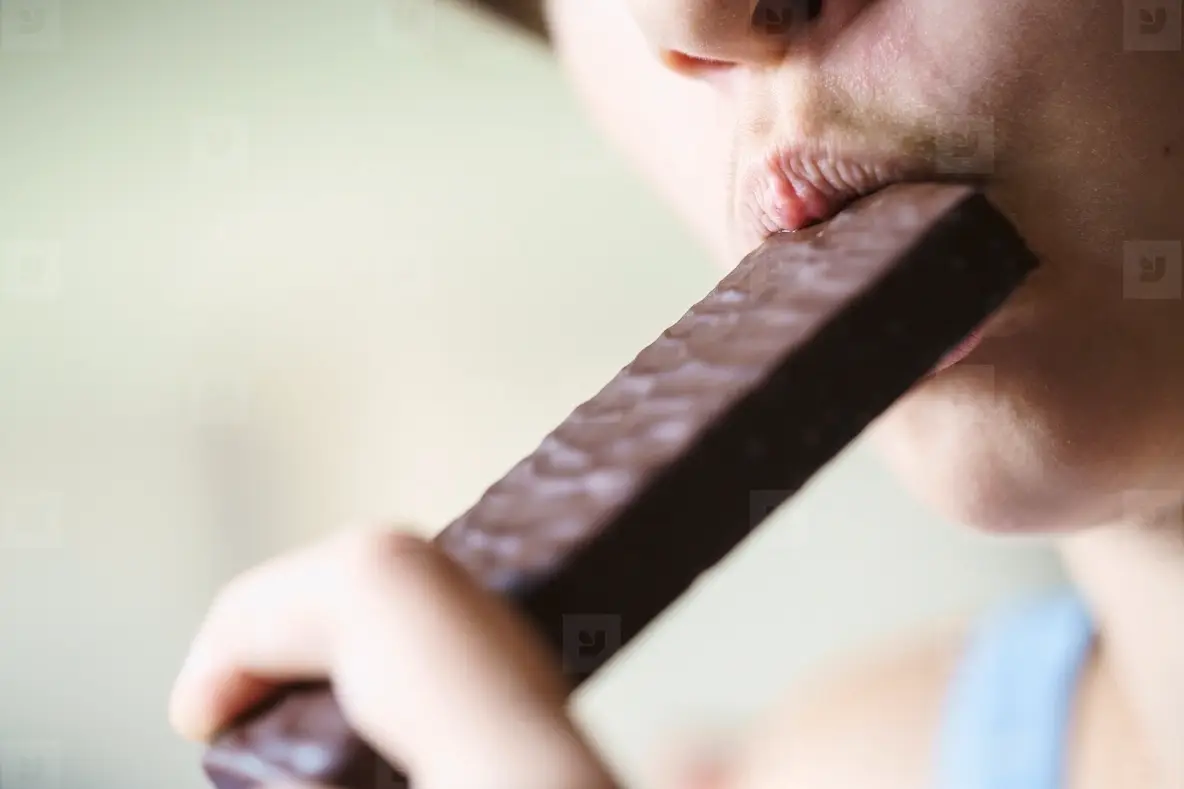 Crop Anonymous Young Girl Eating Chocolate Protein Bar Photo (283475 ...