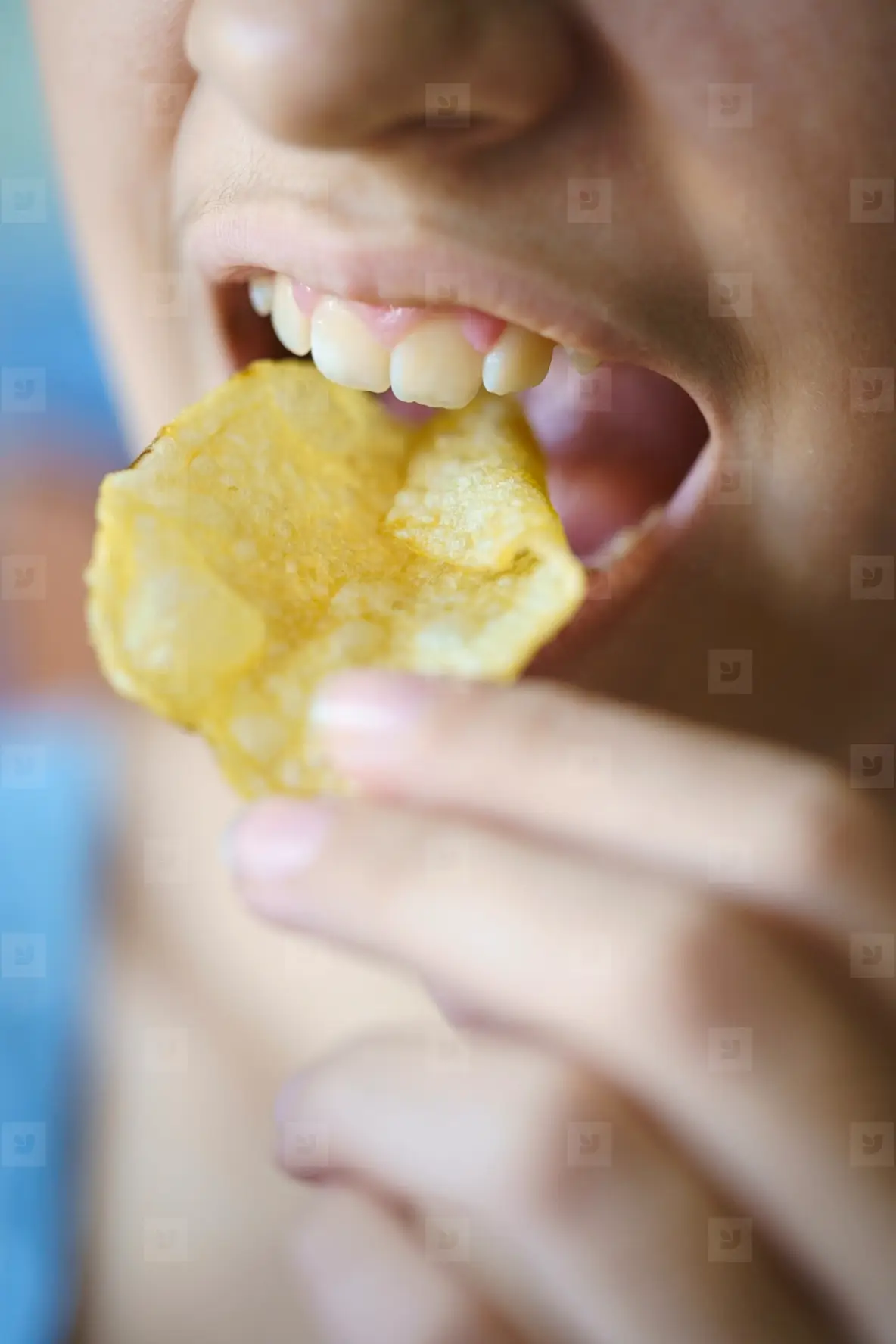 Unrecognizable Teenage Girl Eating Crunchy Potato Chip Photo (283605 ...