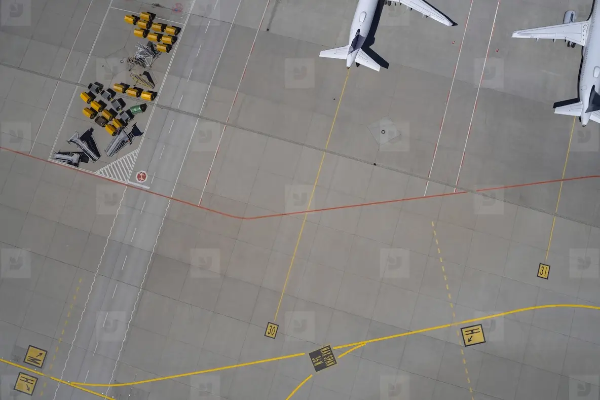 View From Above Airplanes And Luggage Carts On Airport Tarmac Photo ...