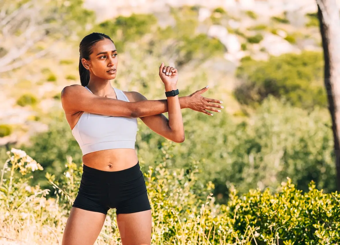 Slim Female In Fitness Wear Stretching Her Hand Outdoors Photo (305344 ...