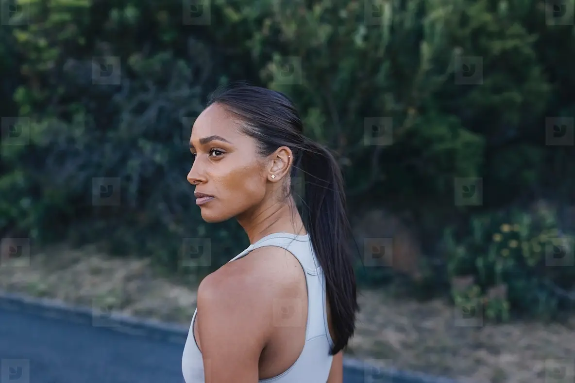 Portrait Of A Young Woman Athlete Looking Away. Young Slim Female ...